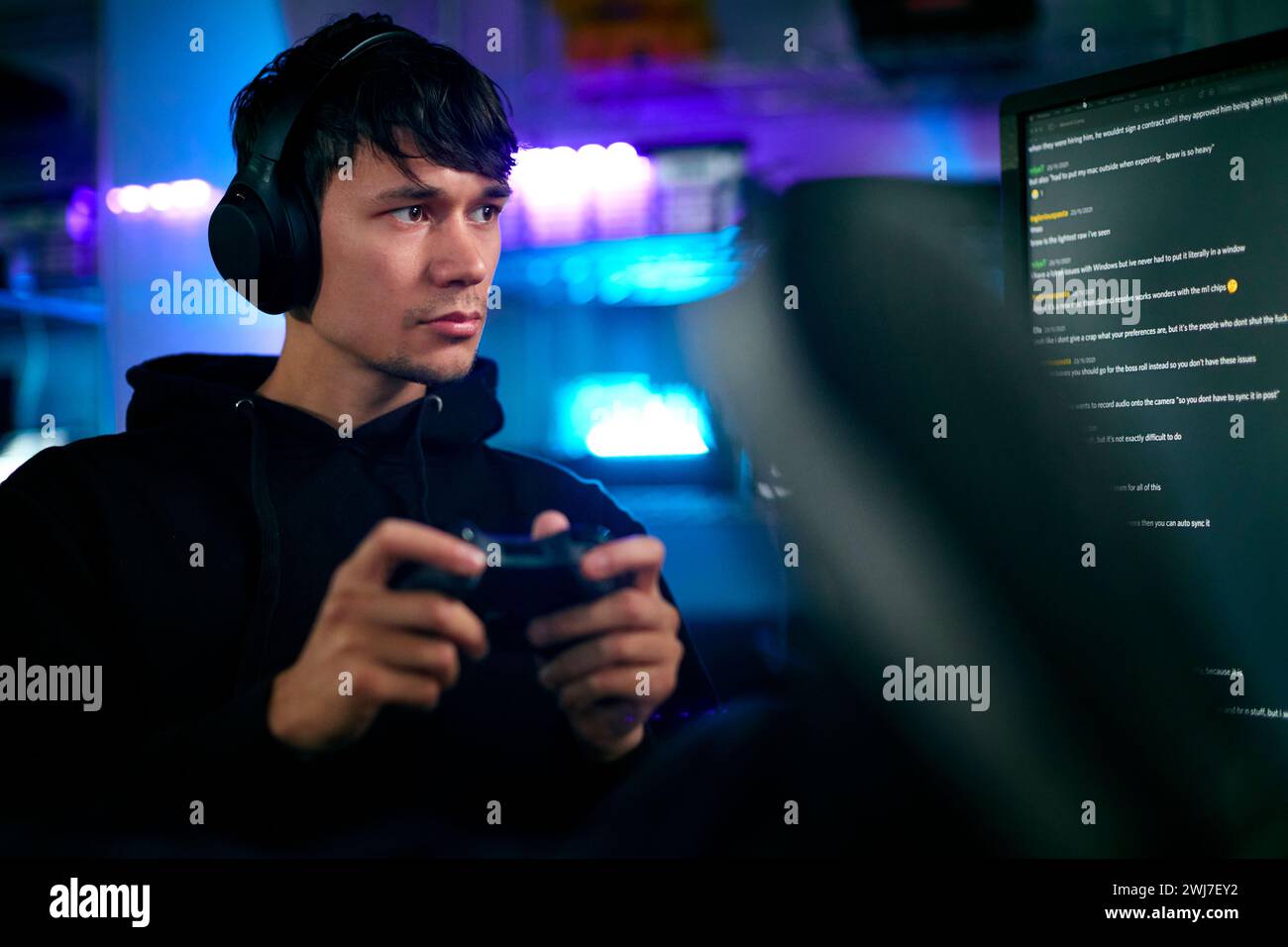 Low Key Lighting Shot Of Male Gamer In Front Of Computer Screens With ...