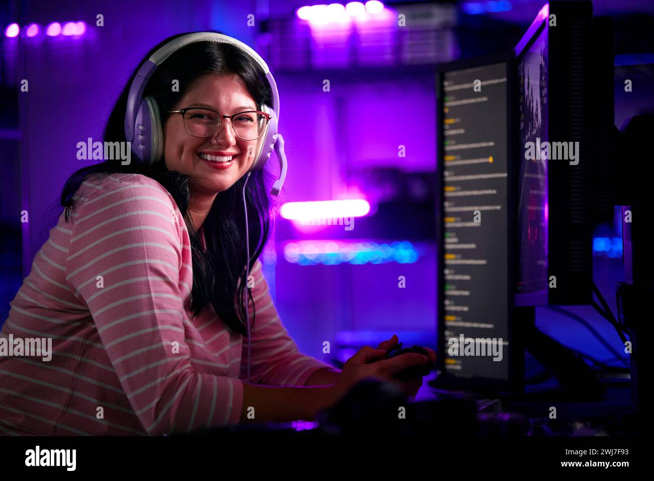 Portrait Of Female Gamer In Front Of Computer Screens With Headphones ...