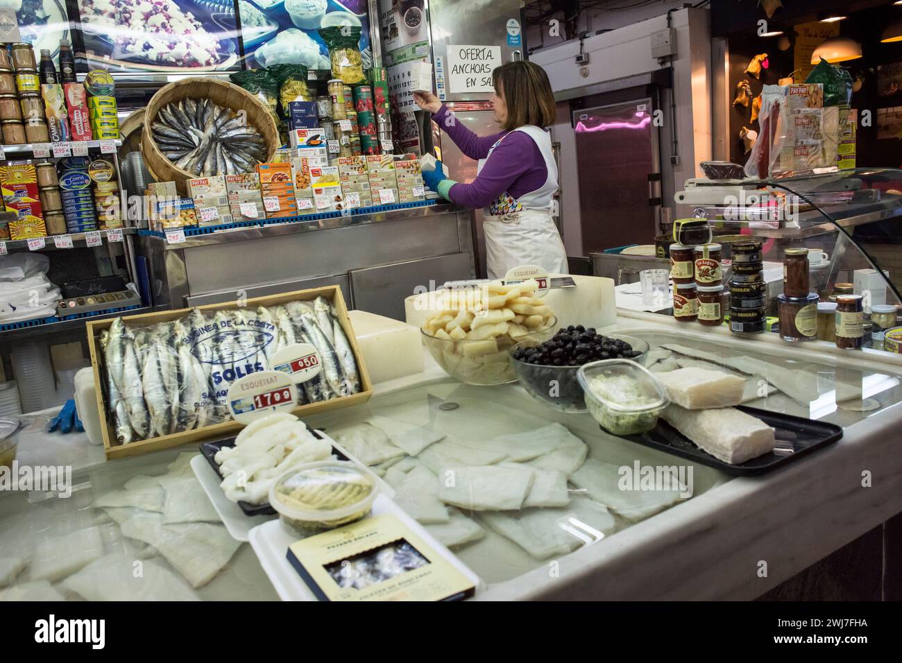 Cod and blue fish stall with its owner arranging the merchandise in the ...