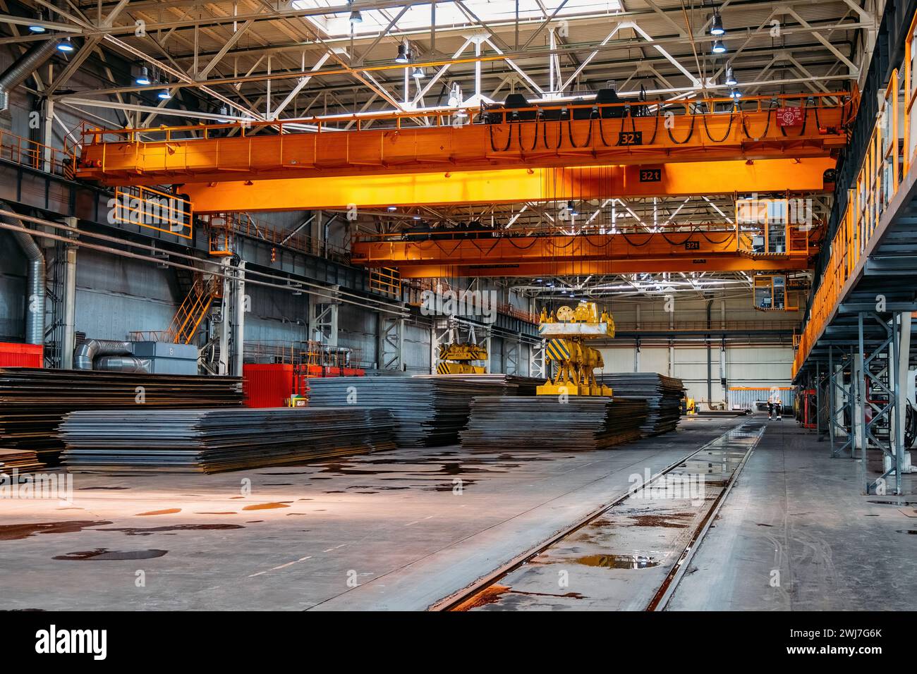 Stack of steel sheets in warehouse Stock Photo - Alamy
