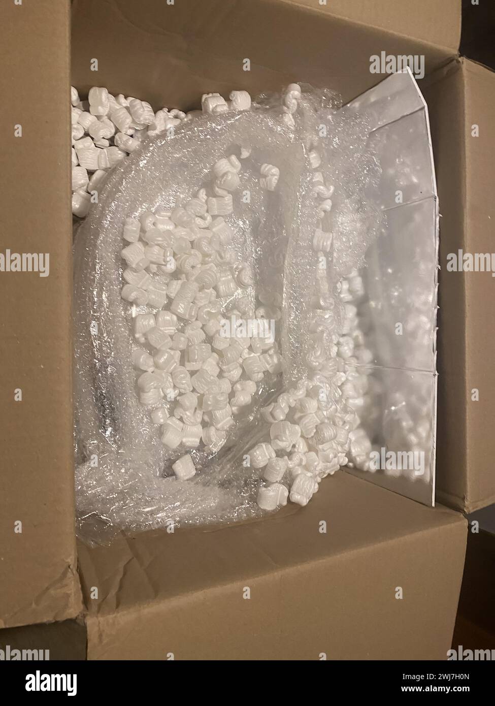 a cardboard box ready for shipping,foam inside to protect object ...