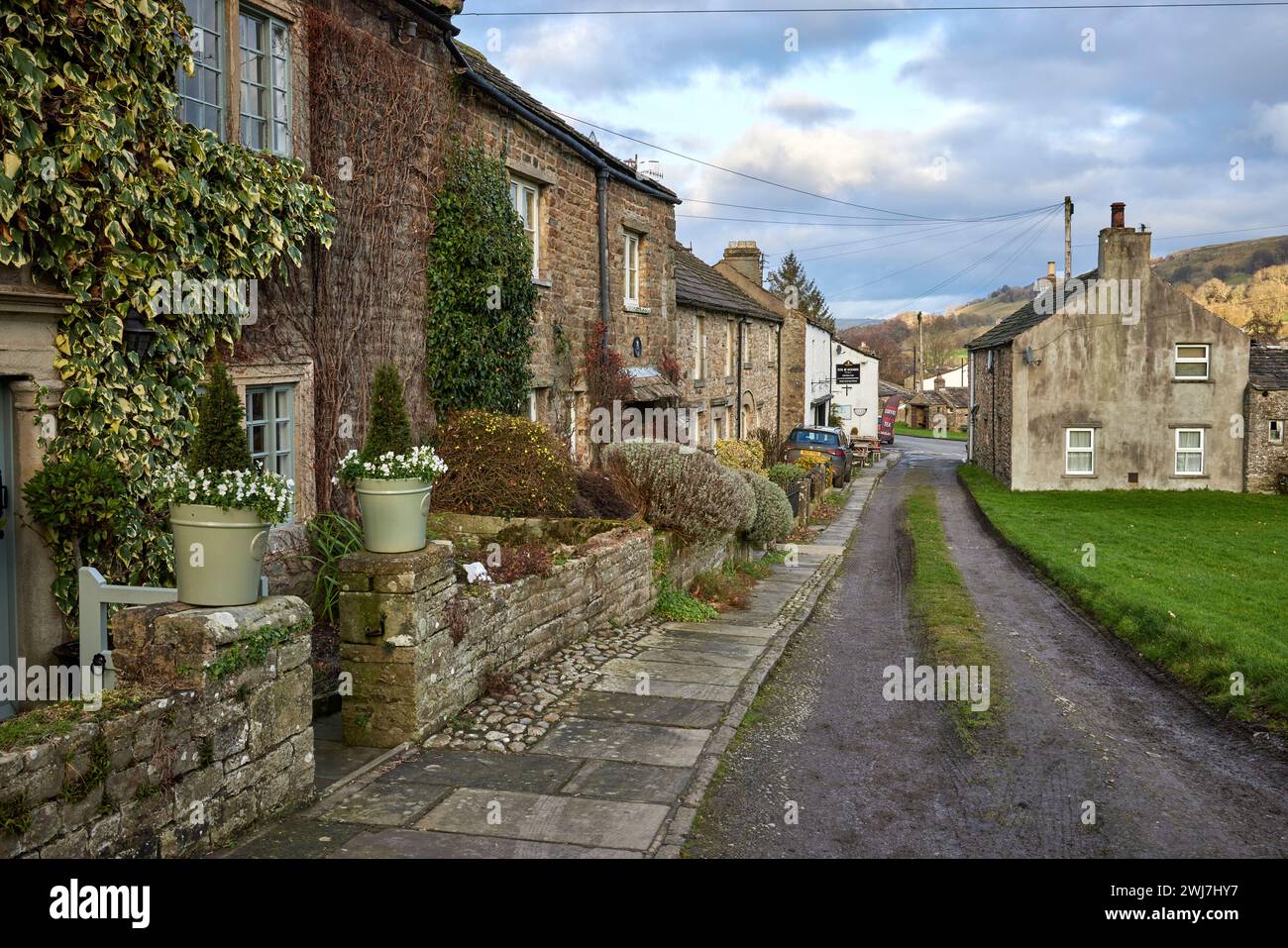 Centre of West Burton with a back lane leading to a row of well kept ...