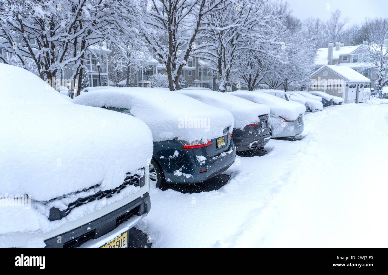 Cars covered with snow in the parking lot of an apartment complex Stock ...