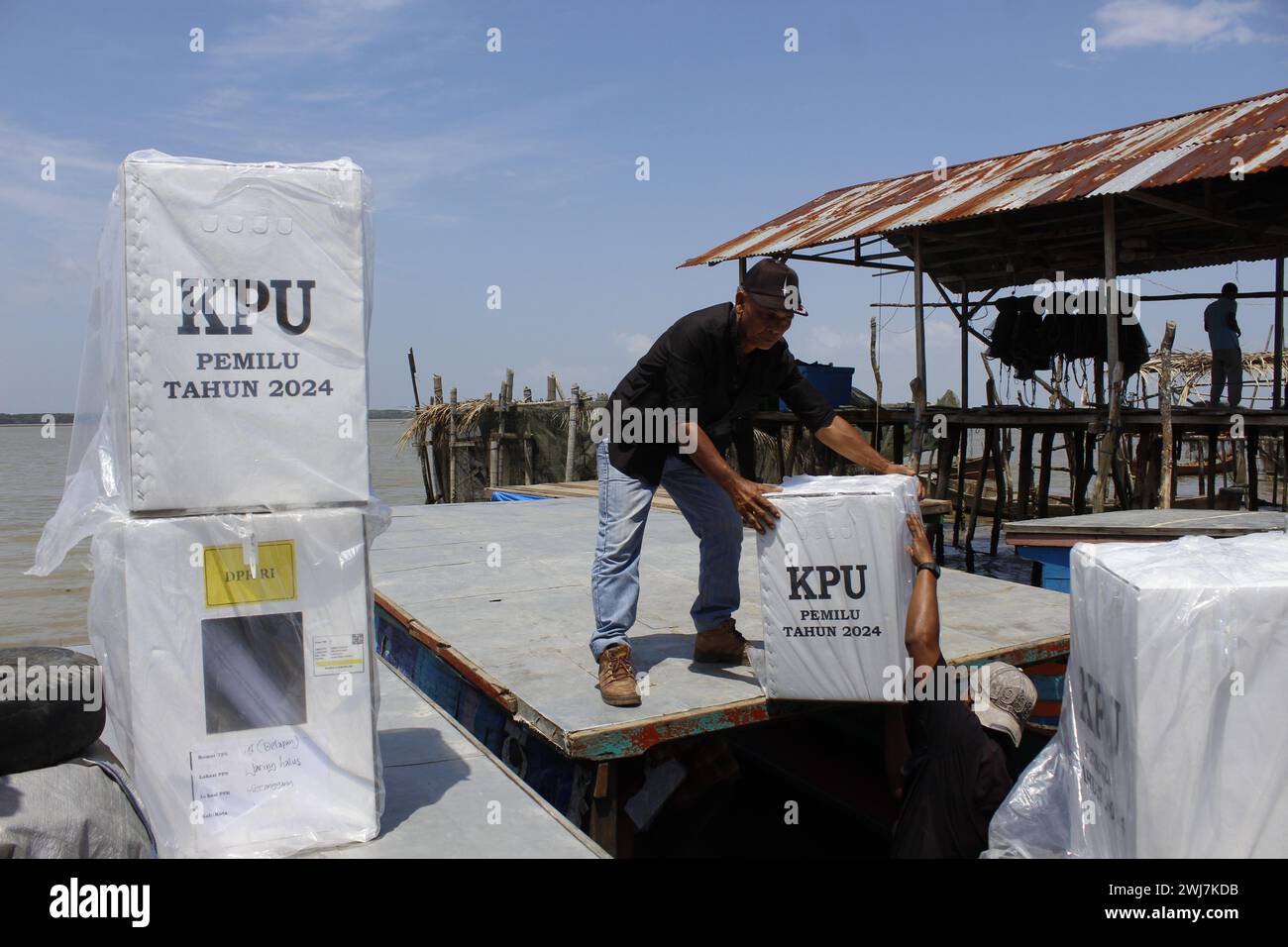 Langkat, Indonesia. 13th Feb, 2024. KPU officers moving ballot boxes ...