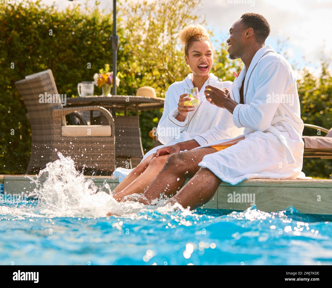 Man sitting pool wearing black hi-res stock photography and images - Alamy