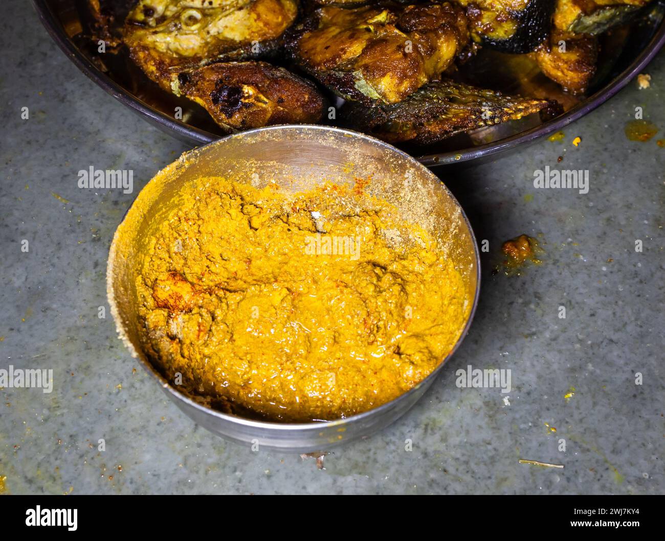 fish mixed spices kept at steel bowl at home Stock Photo - Alamy