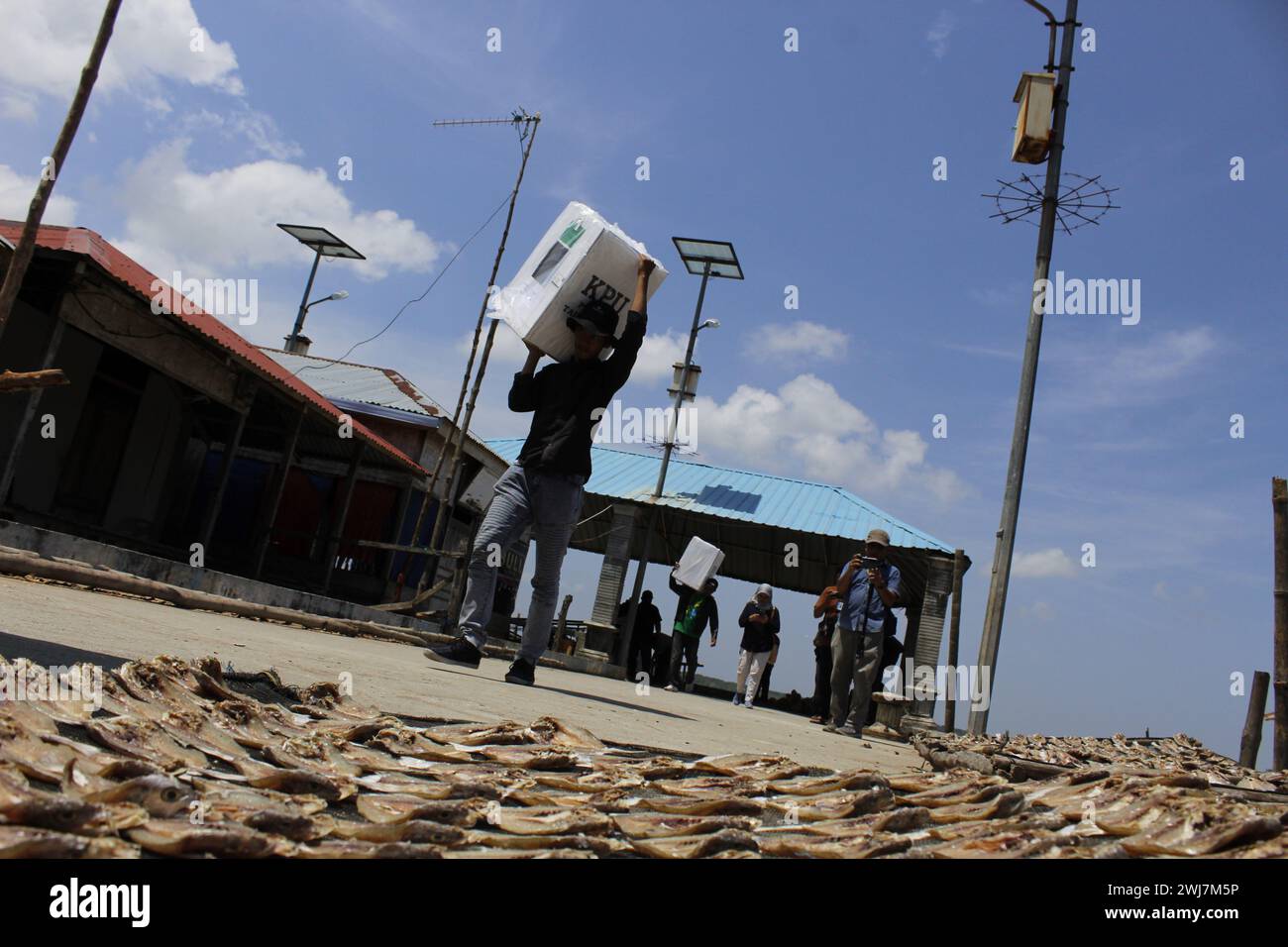 Langkat, Indonesia. 13th Feb, 2024. Two Bawaslu officers seen holding ...
