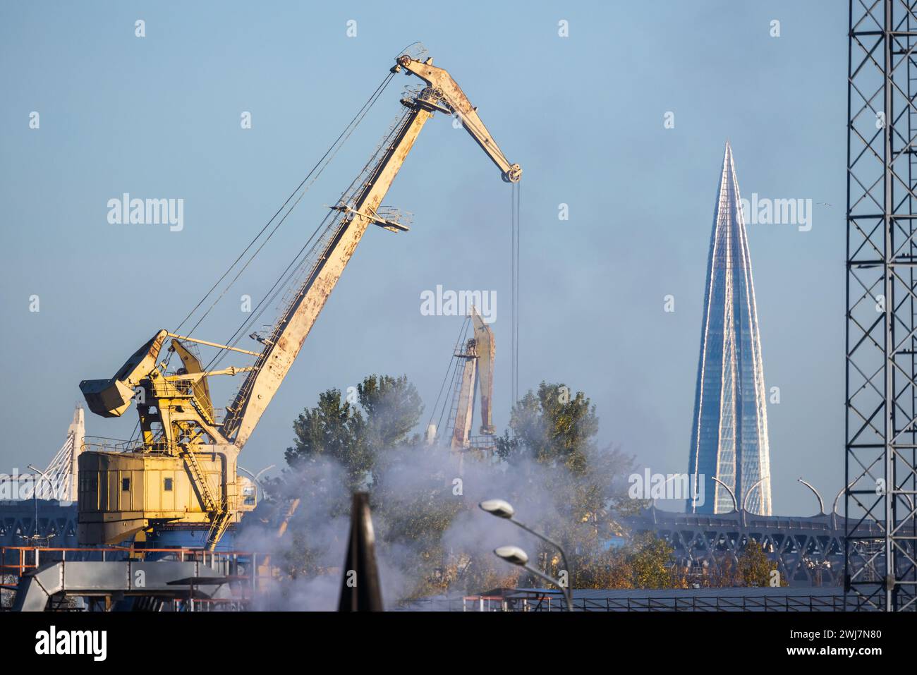Industrial district view with yellow portal crane in port of Saint ...
