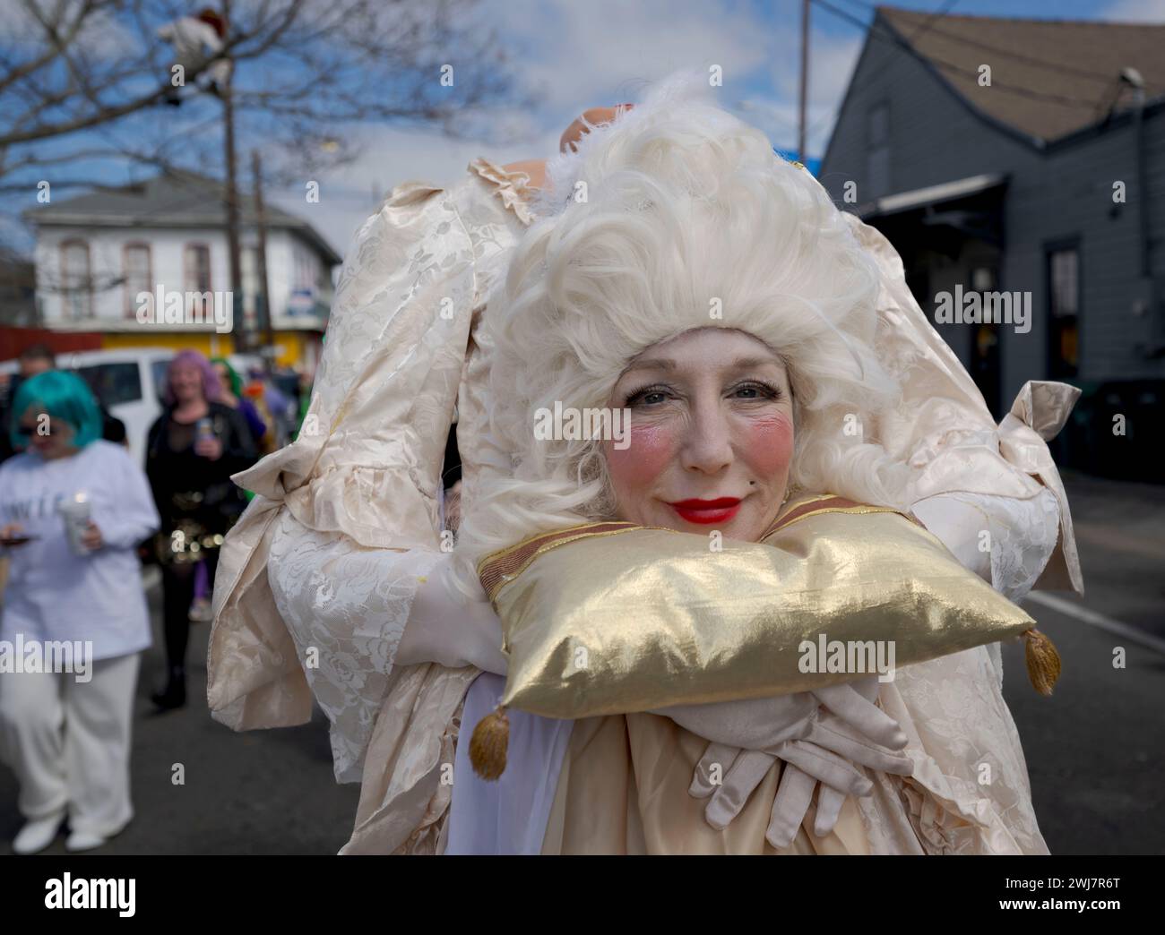 A woman resembles the severed head of Marie Antoinette as she walks in ...