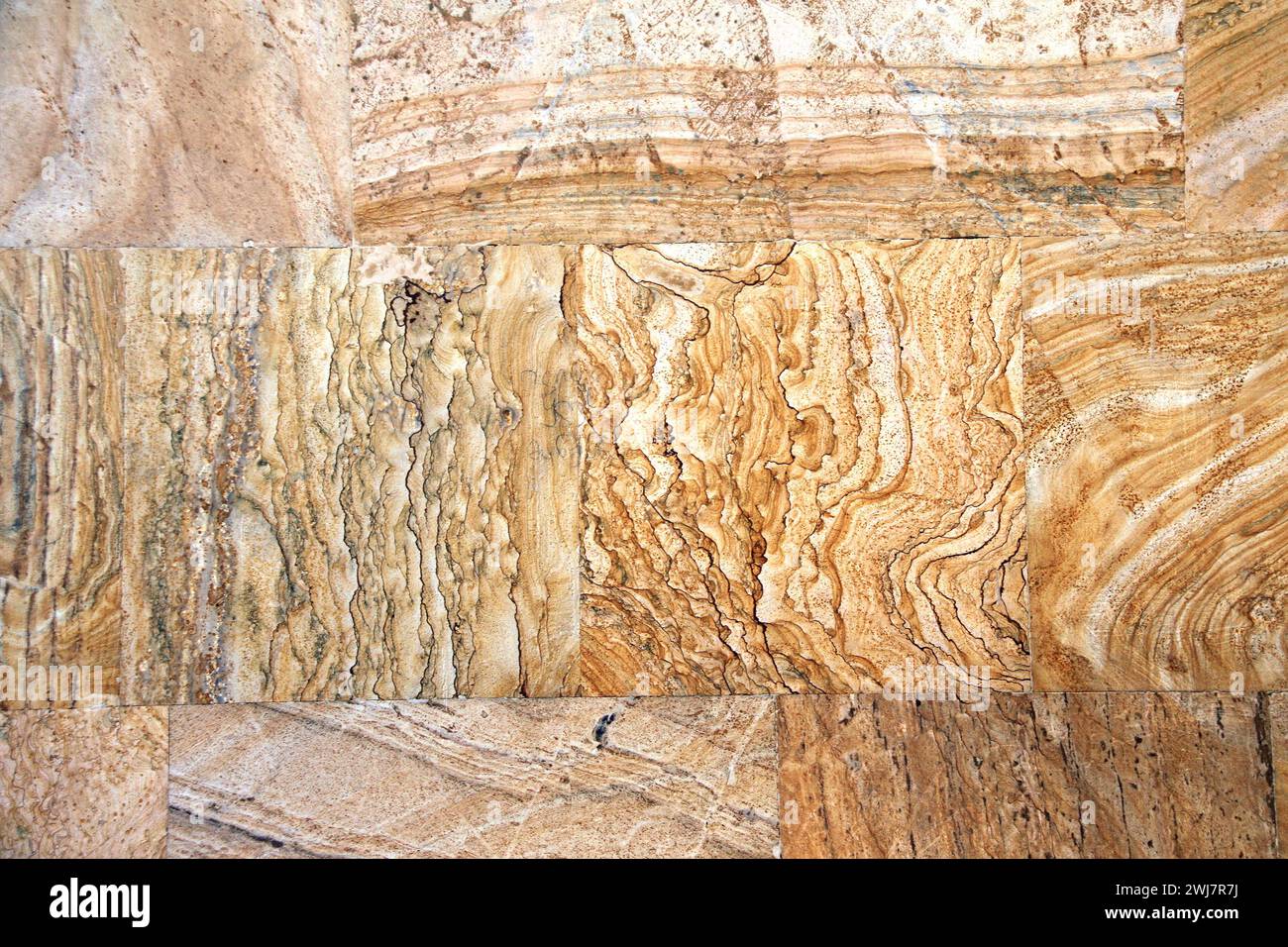 Close up texture of marble of yellow, brown and white color. Natural ...