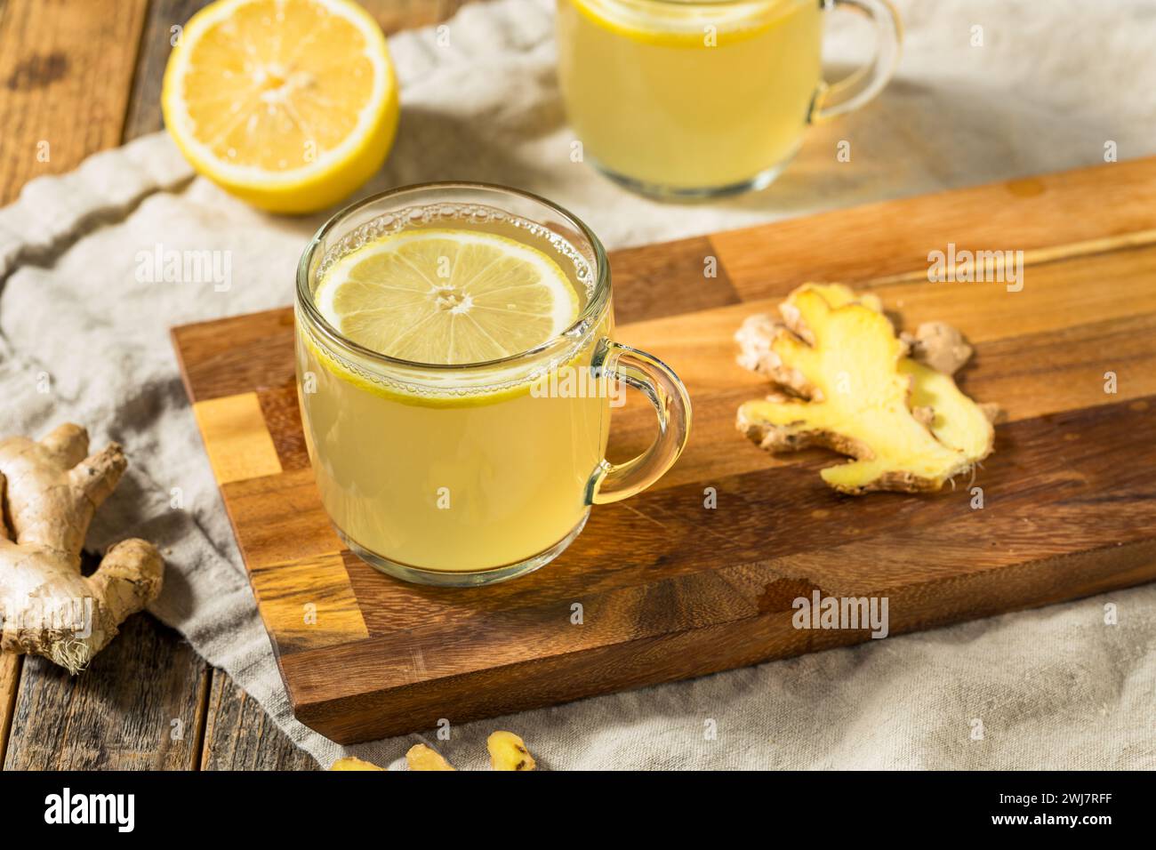 Warm Healthy Ginger Lemon Tea in a Glass Mug Stock Photo - Alamy