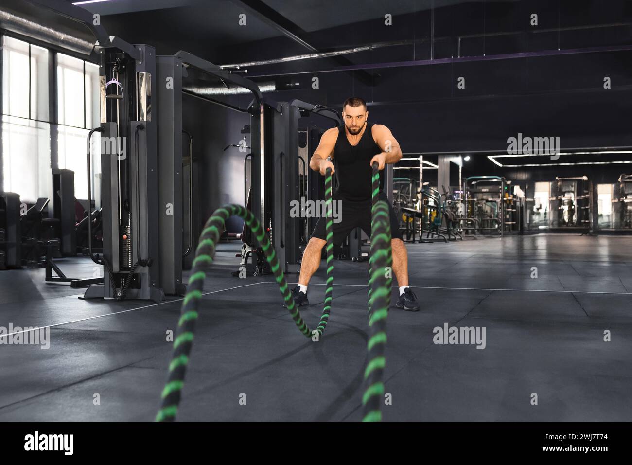 Crossfit man training hands ropes hi-res stock photography and images ...