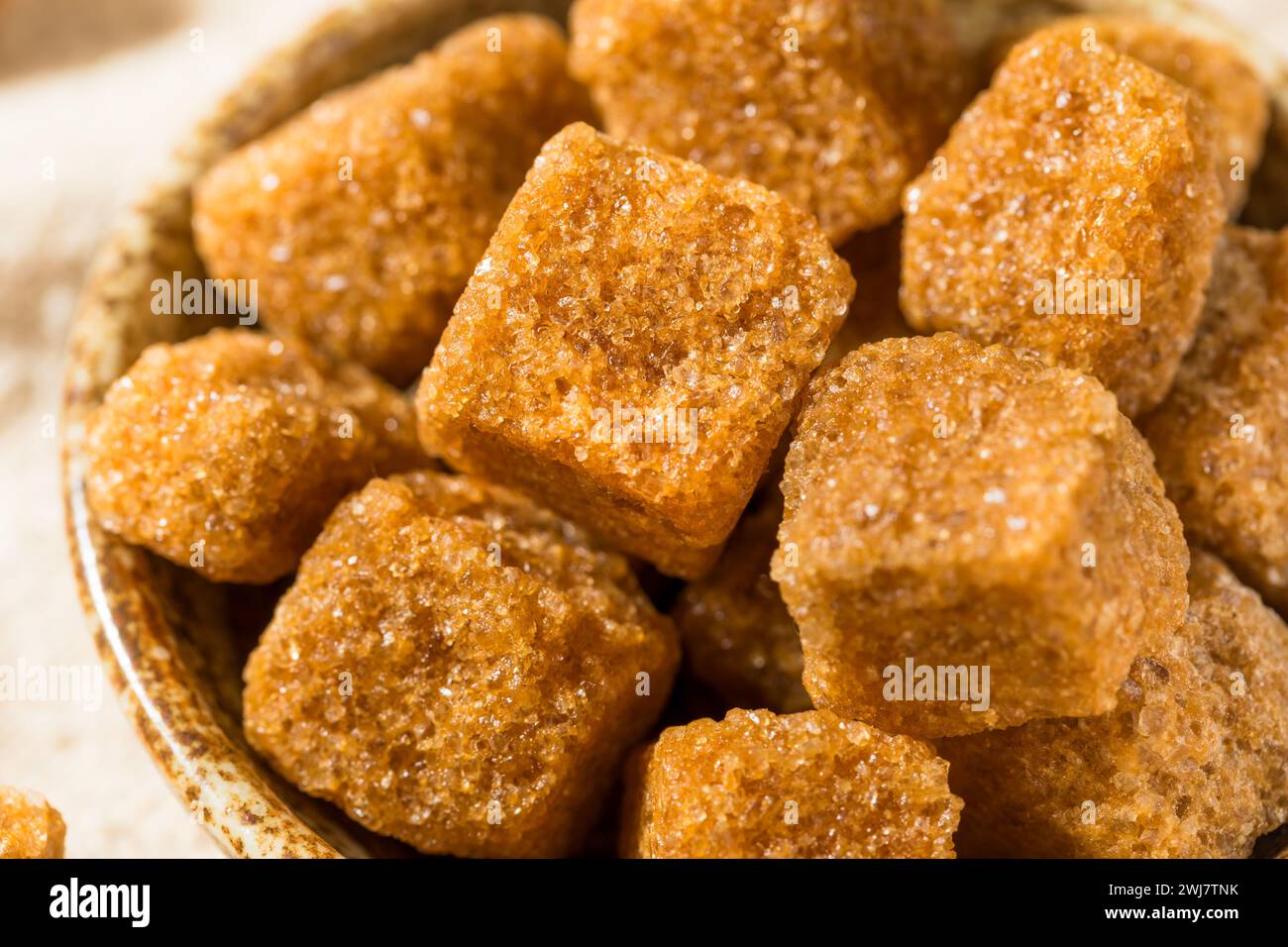 Sweet Brown Raw Sugar Cubes in a Bowl Stock Photo - Alamy
