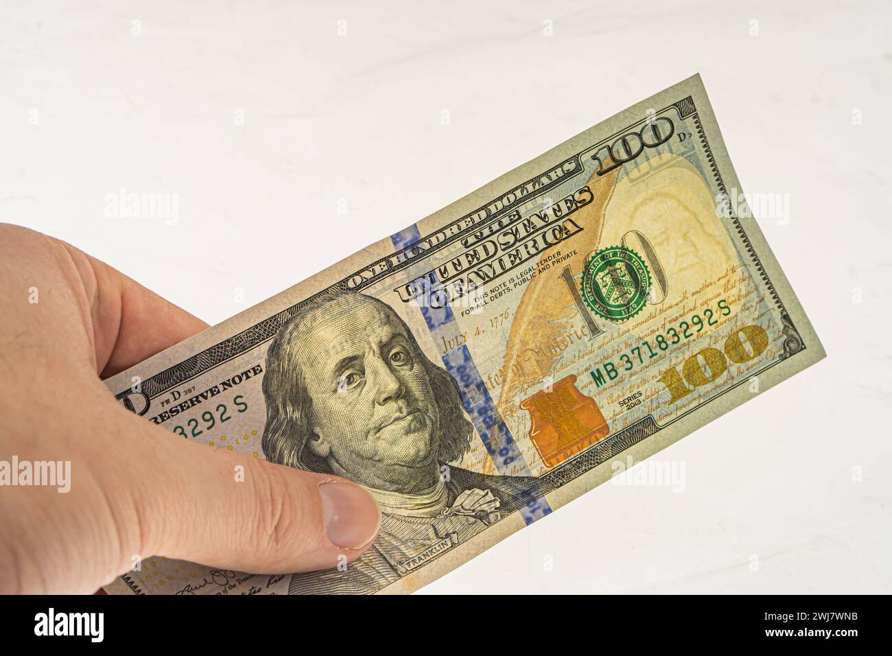 Authentication of banknote 100 dollars for clearance. Watermarks on a ...