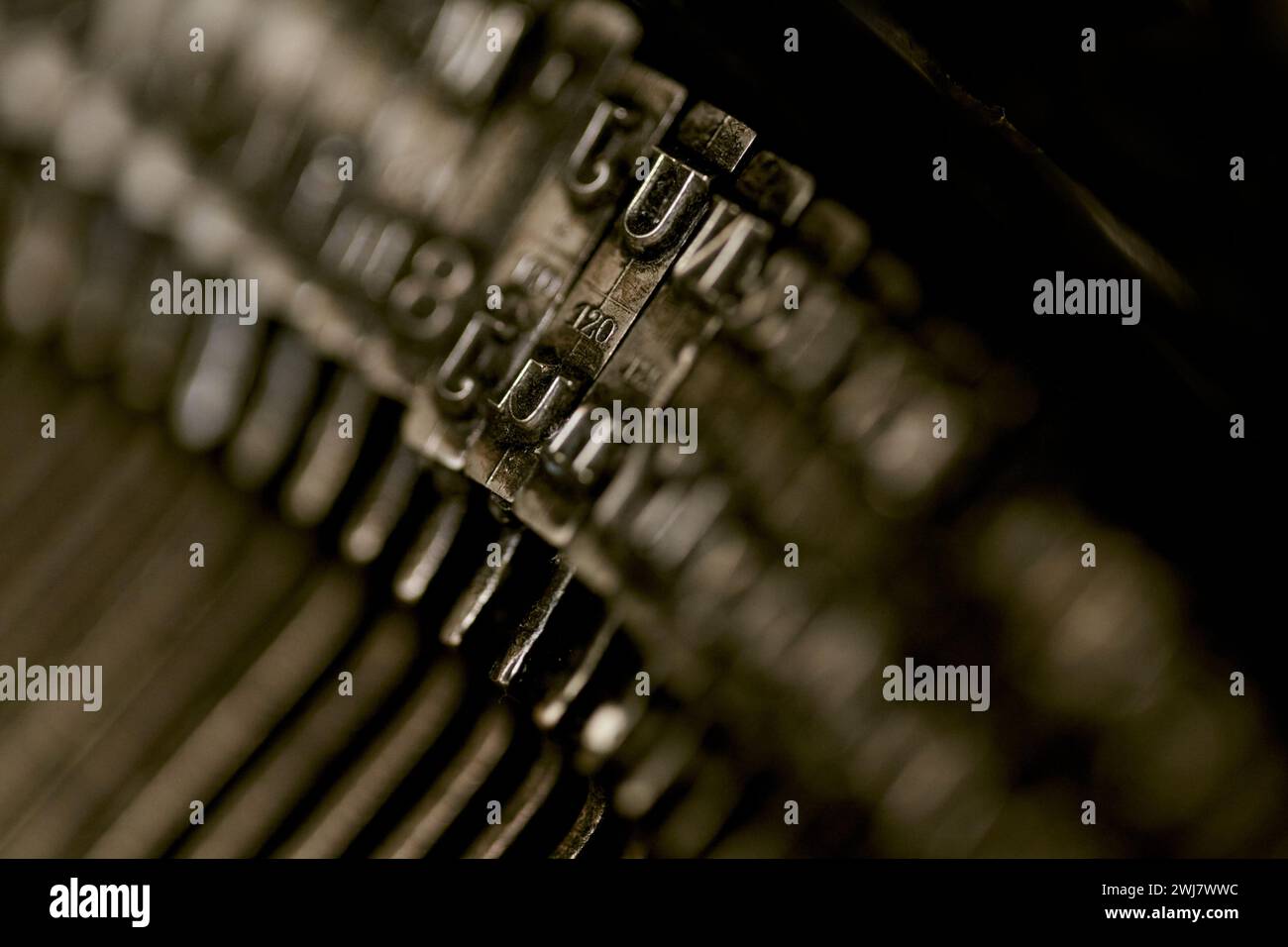 Closeup of old typewriter plates strikers strykers with letters and ...