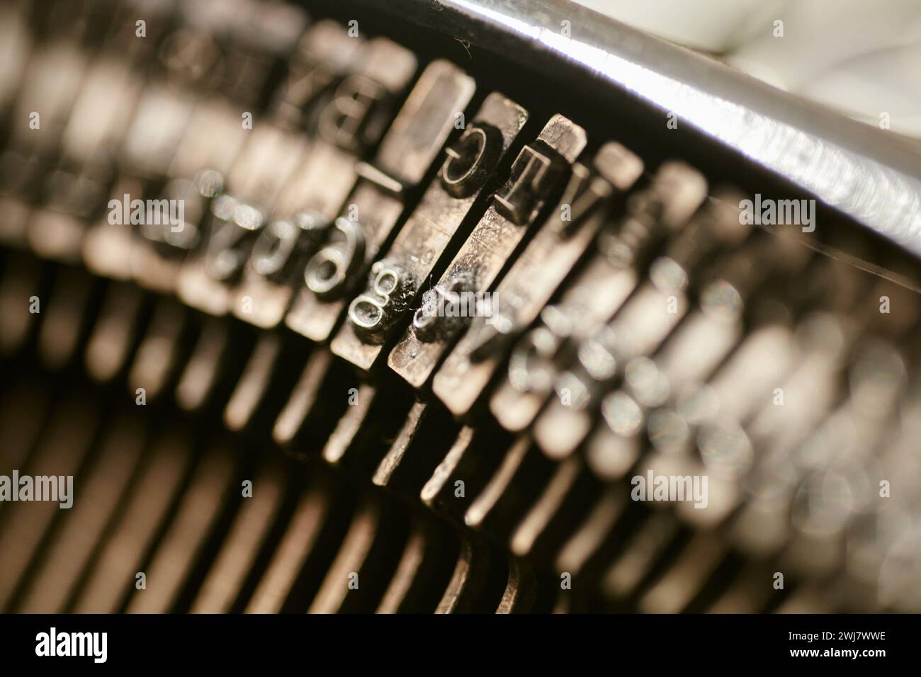 Closeup of old typewriter plates strikers strykers with letters and ...