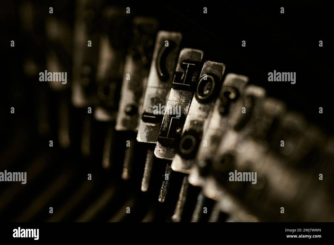 Closeup of old typewriter plates strikers strykers with letters and ...