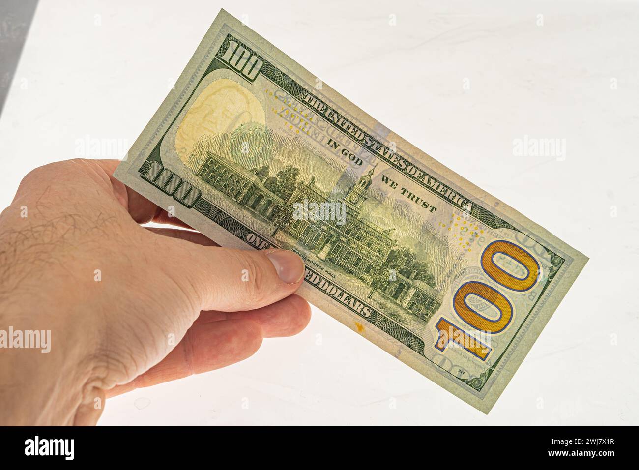 Authentication of banknote 100 dollars for clearance. Watermarks on a ...