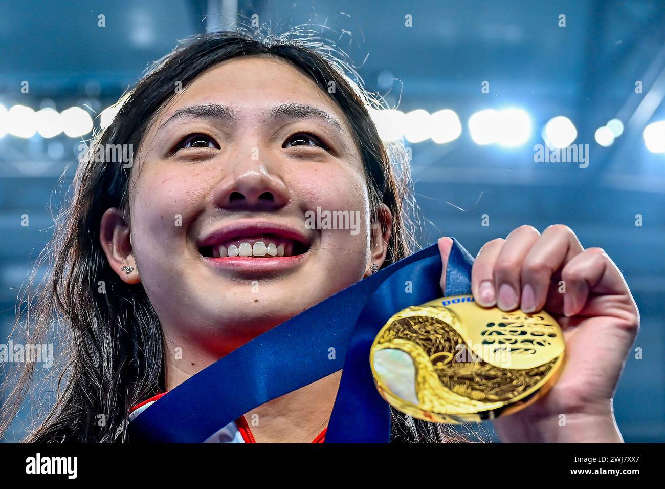 Doha, Qatar. 13th Feb, 2024. Qianting Tang of China shows the gold ...