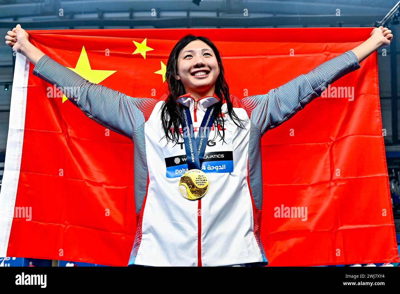 Doha, Qatar. 13th Feb, 2024. Qianting Tang of China shows the gold ...