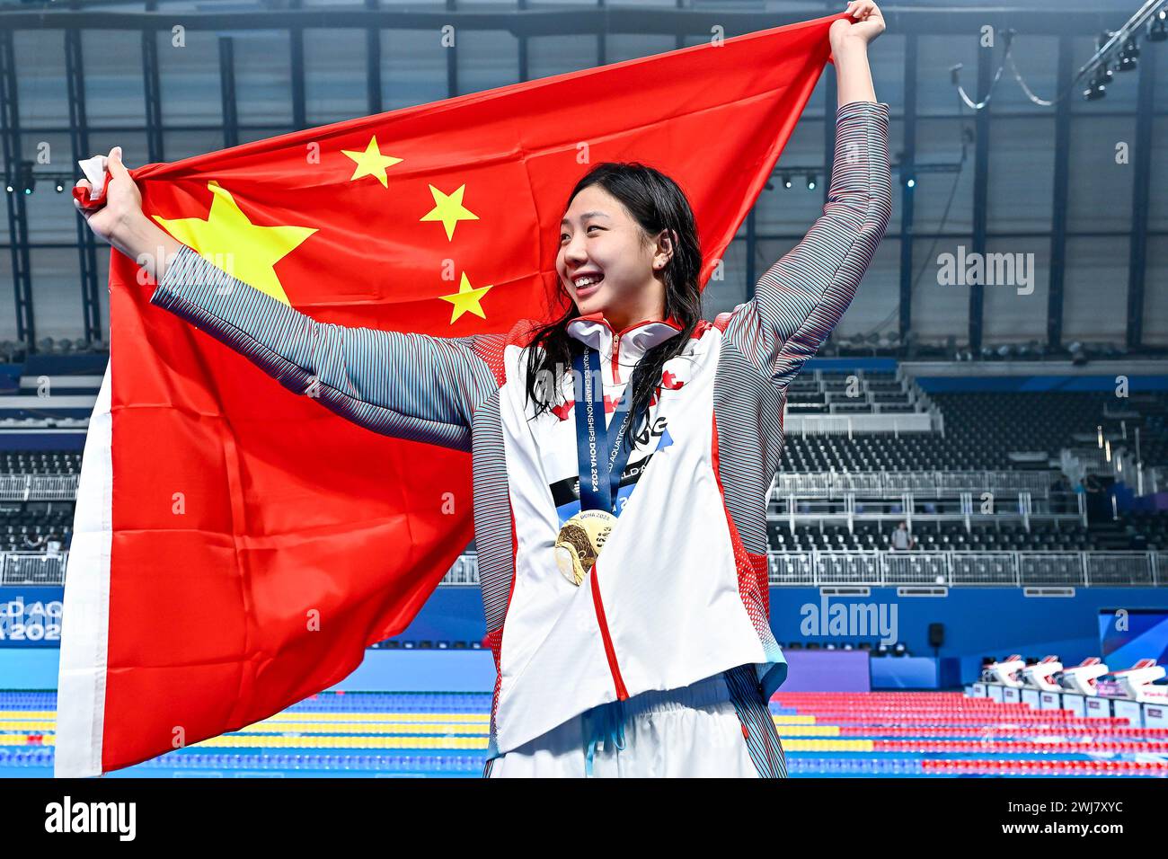 Doha, Qatar. 13th Feb, 2024. Qianting Tang of China shows the gold ...