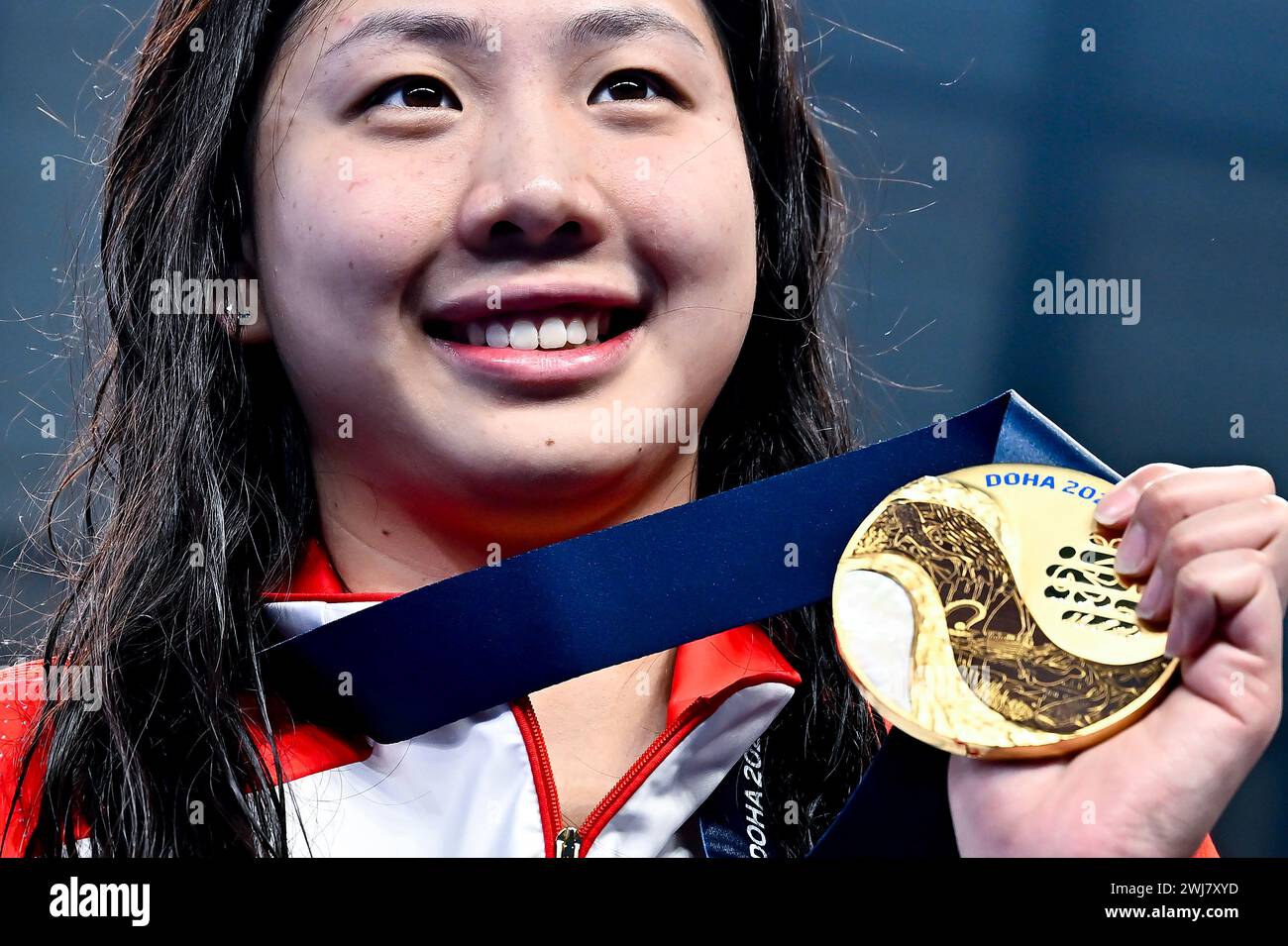 Doha, Qatar. 13th Feb, 2024. Qianting Tang of China shows the gold ...