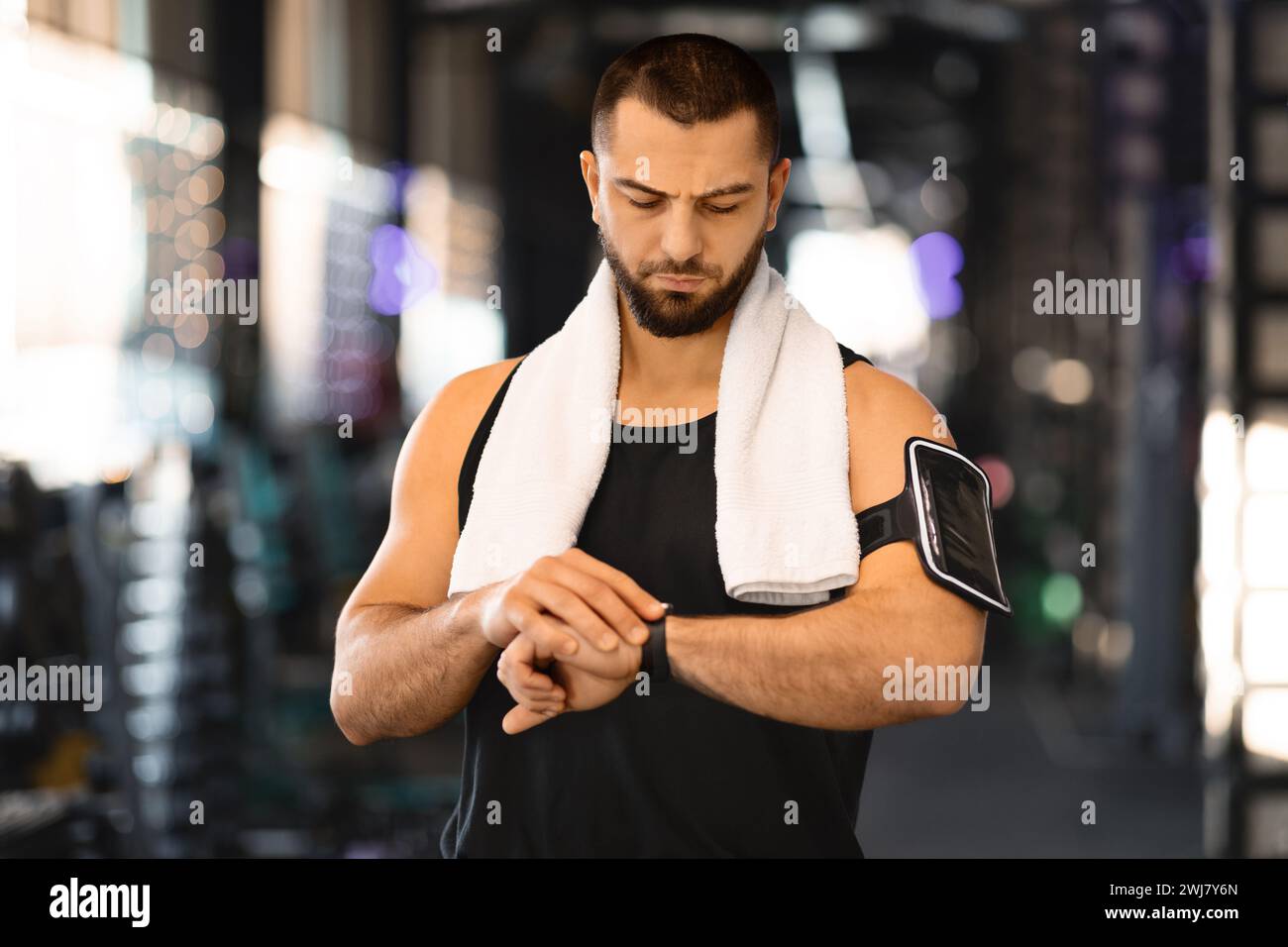 Bearded man checking smartwatch hi-res stock photography and images - Alamy