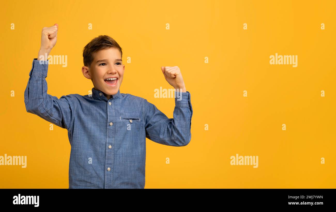 Yes. Overjoyed Teen Boy Shaking Fists, Celebrating Success Over Yellow ...