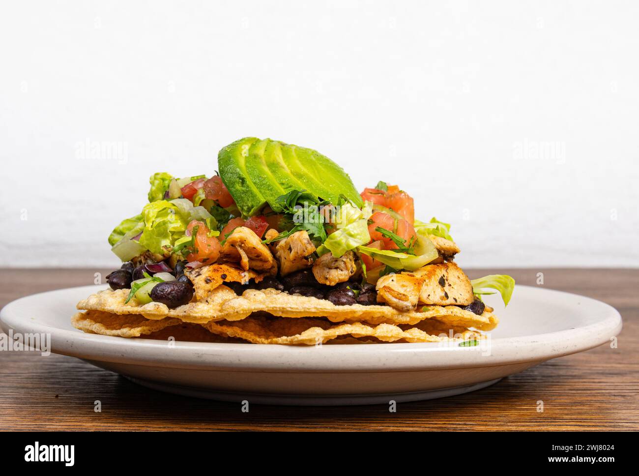 A tortilla layered over a stack of tortillas Stock Photo - Alamy