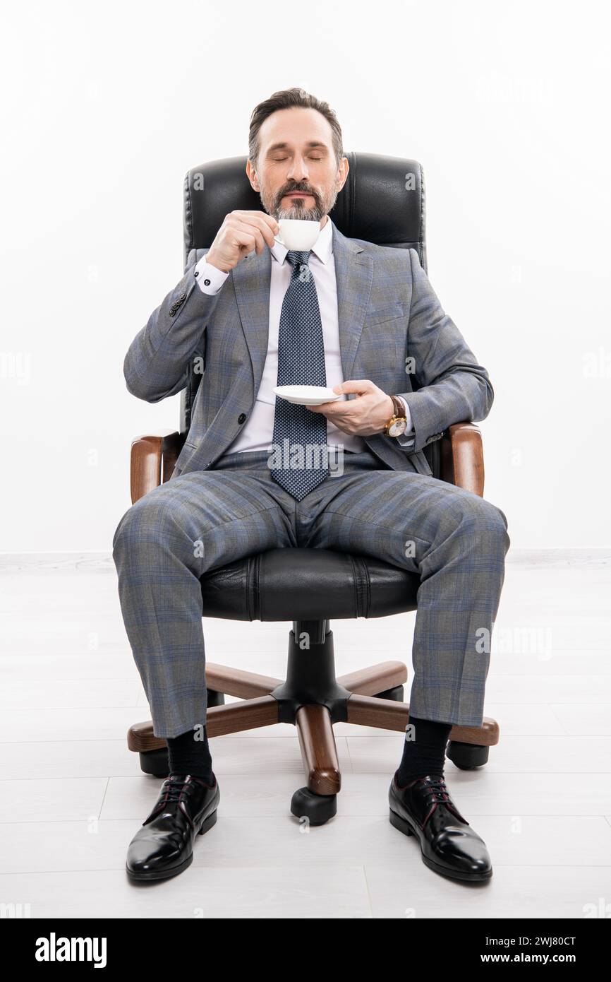 successful businessman man in boss office shows business success and ...