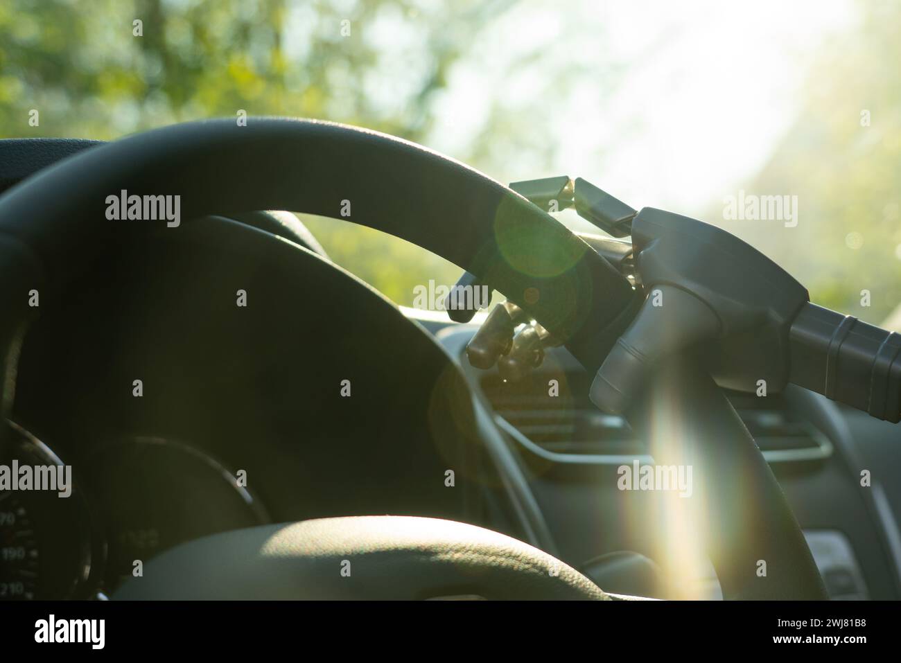 Robot arm on a steering wheel. Artificial intelligence drives a car ...