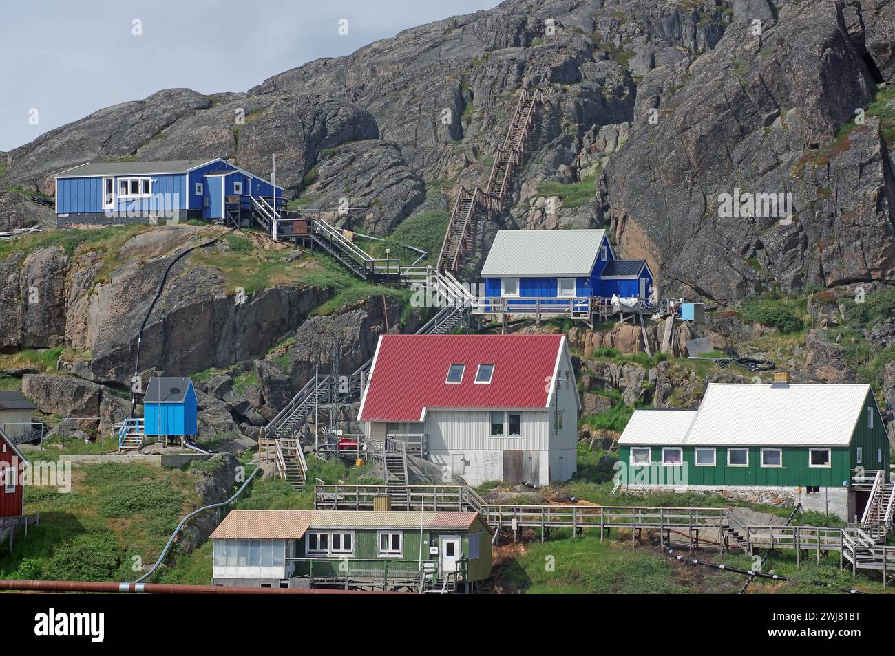 Houses connected by wooden stairs, barren mountains, Maniitsoq ...