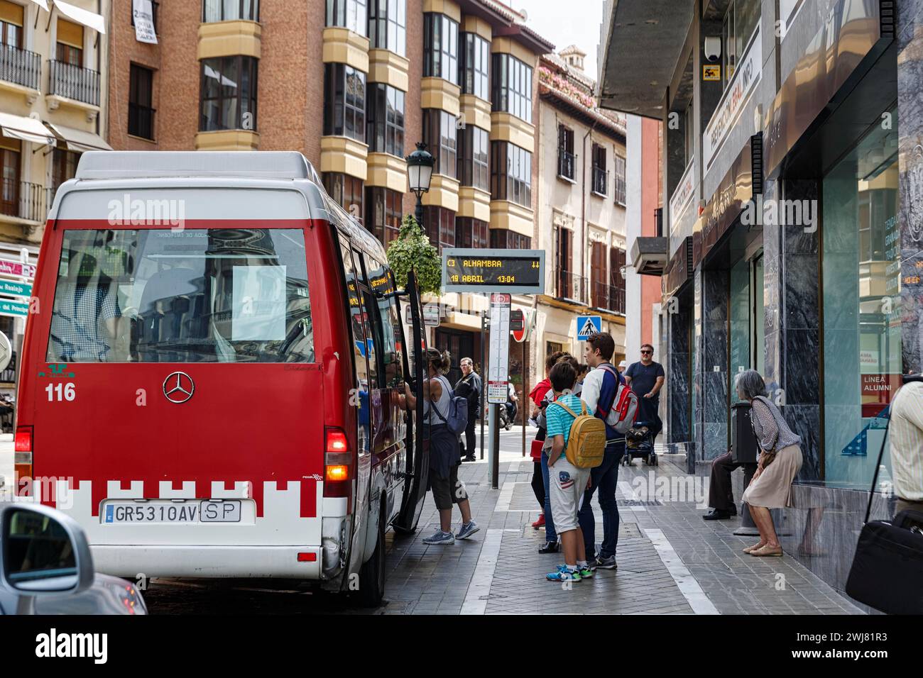 Tourists at bus stop, bus to the Alhambra, Granada, Andalusia, Spain ...