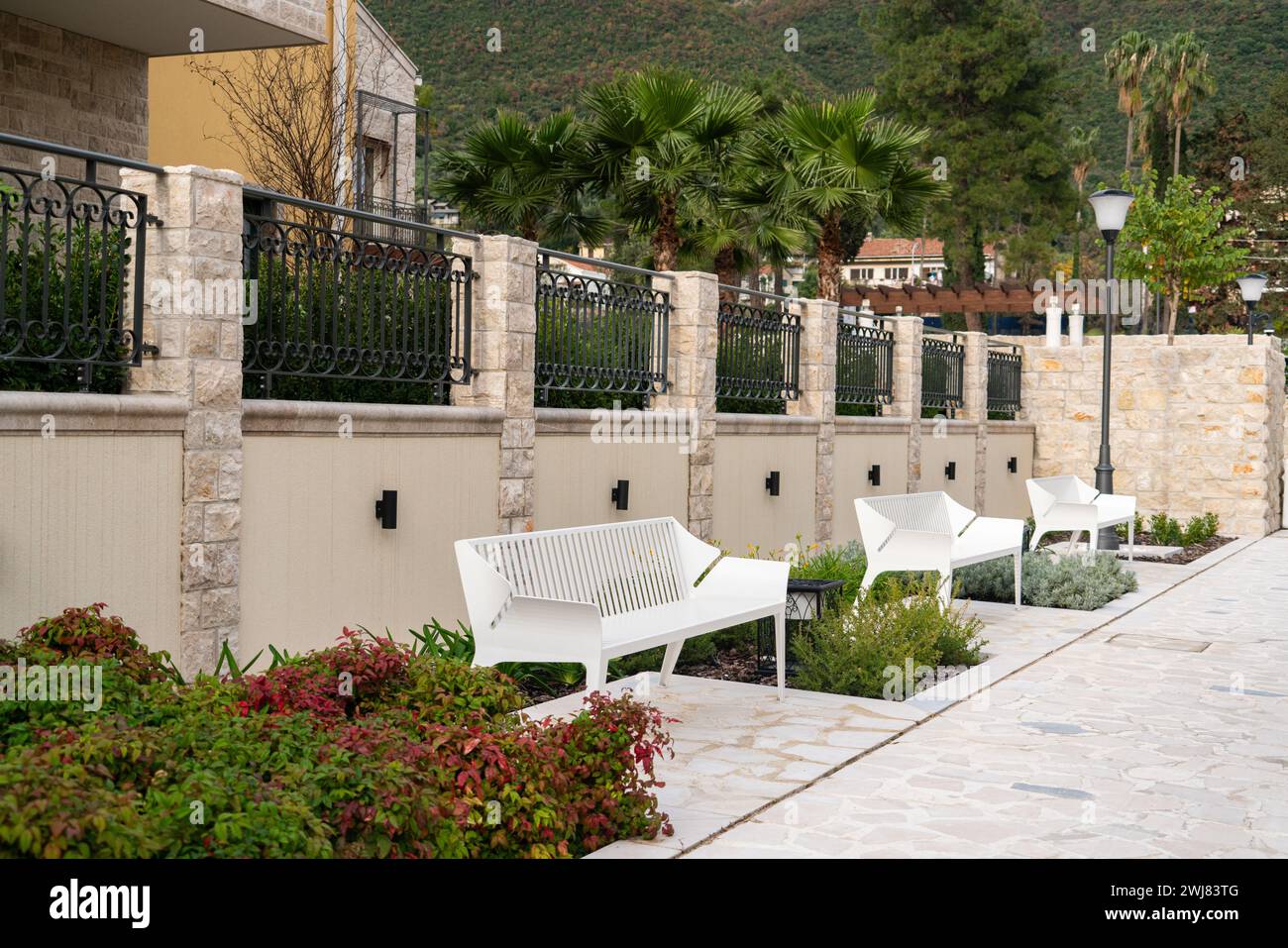 White bench in a summer resort Stock Photo - Alamy