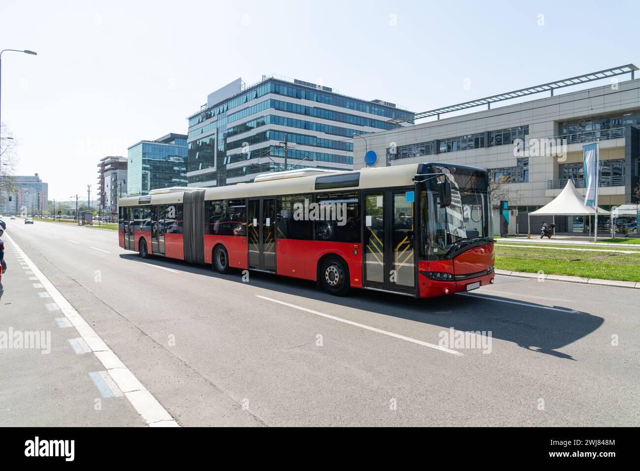 Modern bus on the city street Stock Photo - Alamy