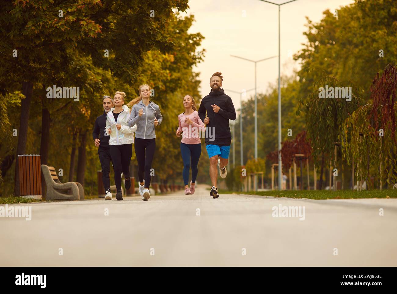 Group positive diverse friends sport hi-res stock photography and ...