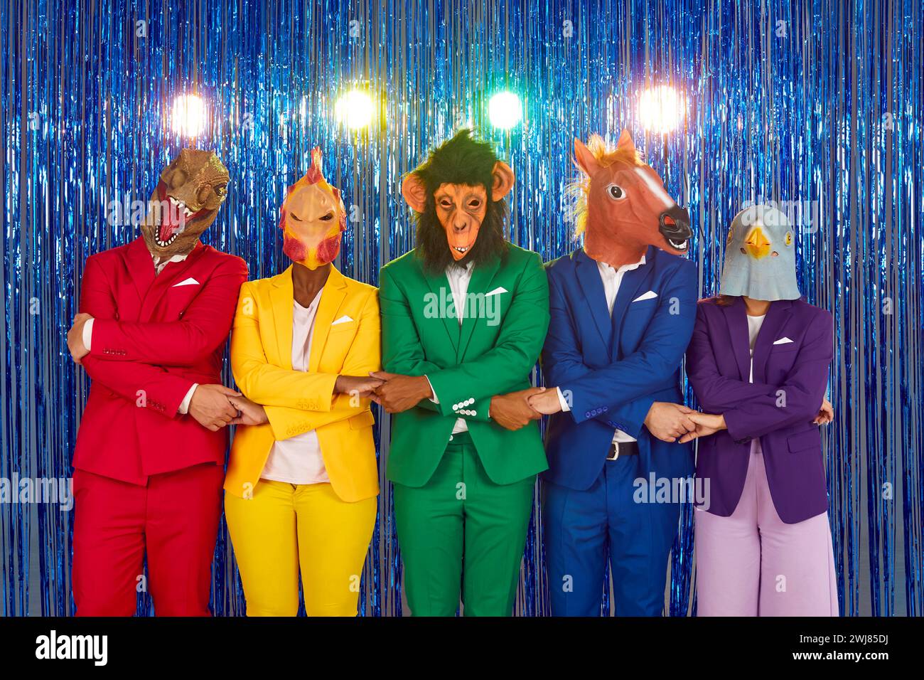Group of young friends in a club on a shiny blue background Stock Photo ...