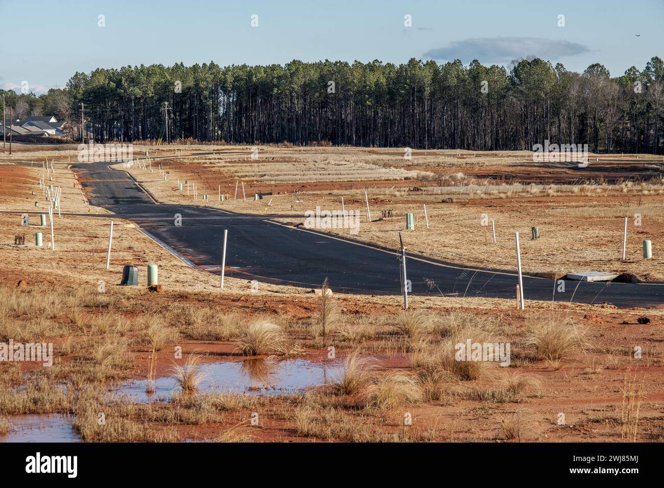 Blacktop road installed in a large new subdivision development that has ...