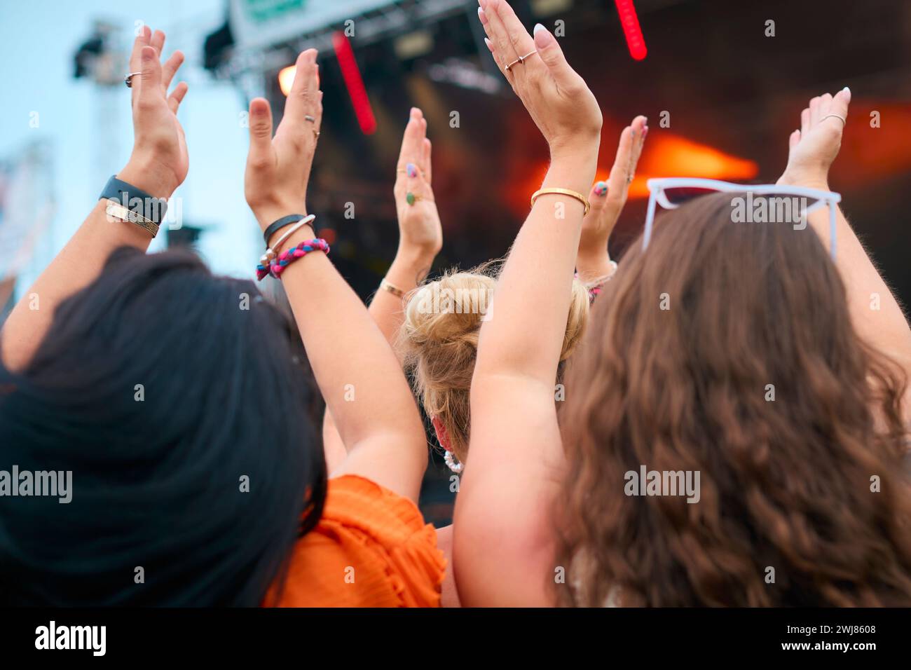 Rear View Of Audience Enjoying Concert At Outdoor Summer Music Festival ...