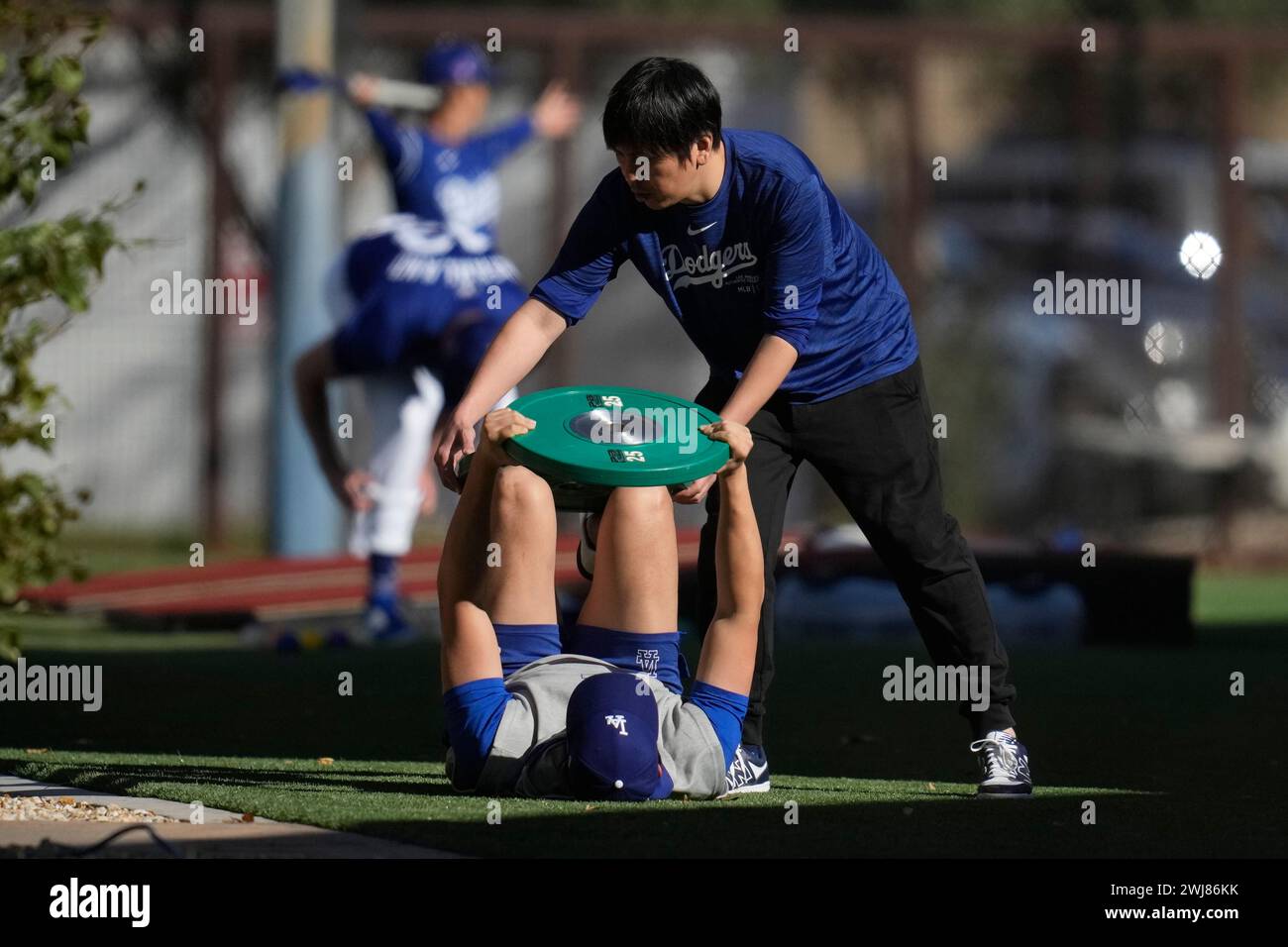 Los Angeles Dodgers designated hitter Shohei Ohtani, bottom, and his interpreter Ippei Mizuhara ...