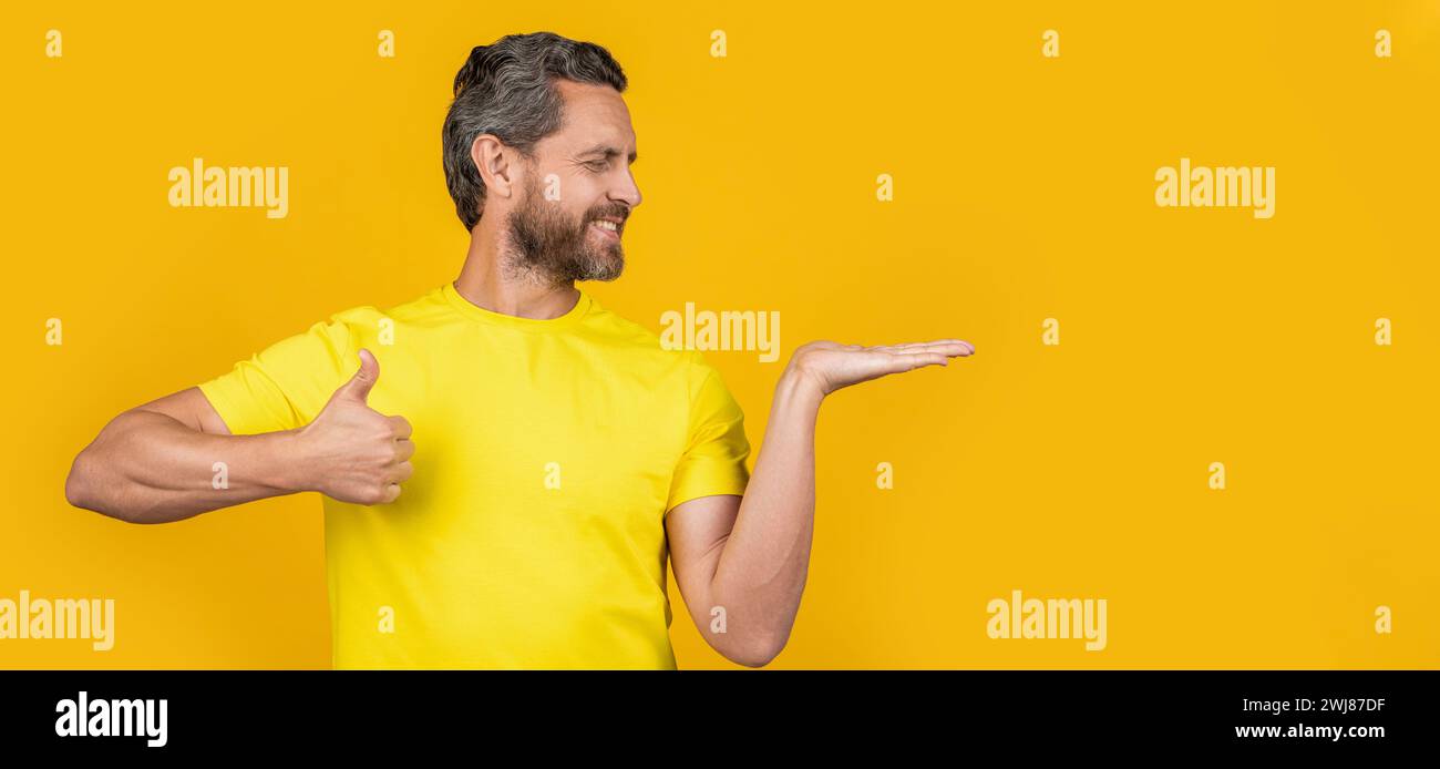 man presenting advertisement on background with copy space banner. man ...