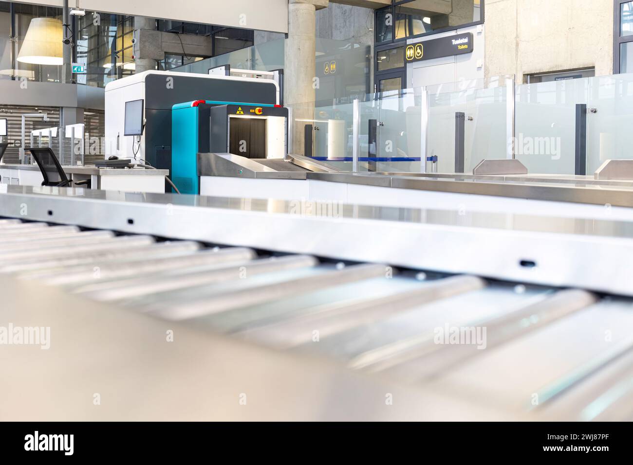Security baggage scanners and gates with metal detectors at airport ...