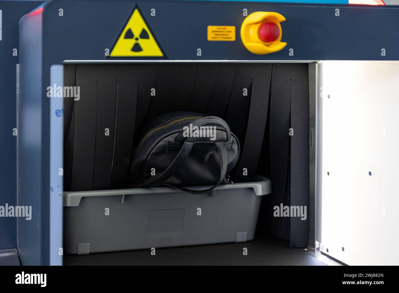 Close-up of scanning travel baggage with x-ray scanner at airport ...