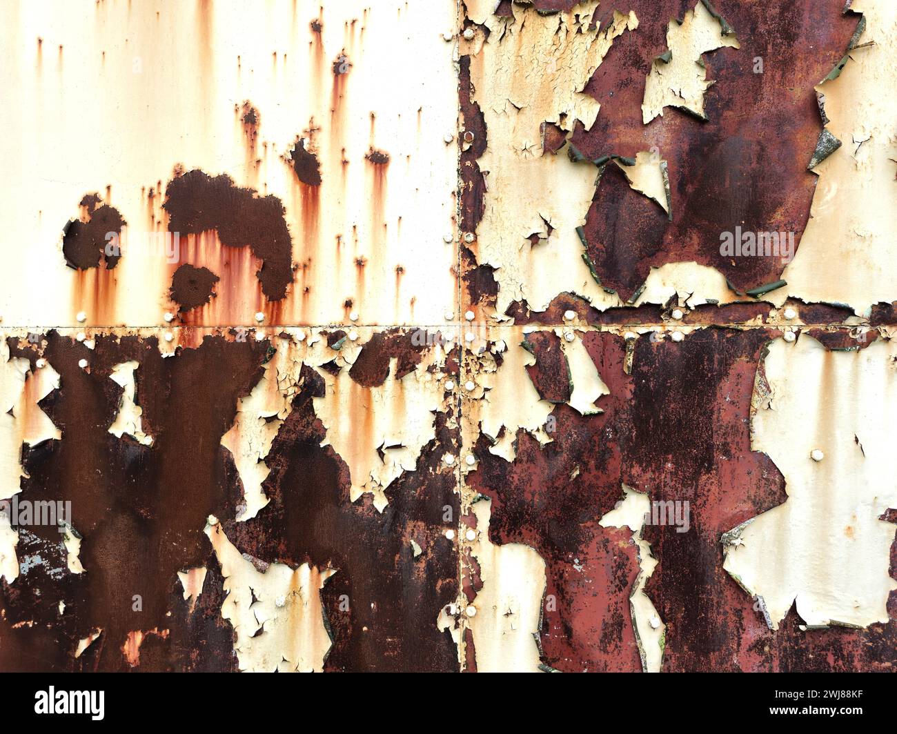 Peeling paint and rust on hangar doors Stock Photo - Alamy