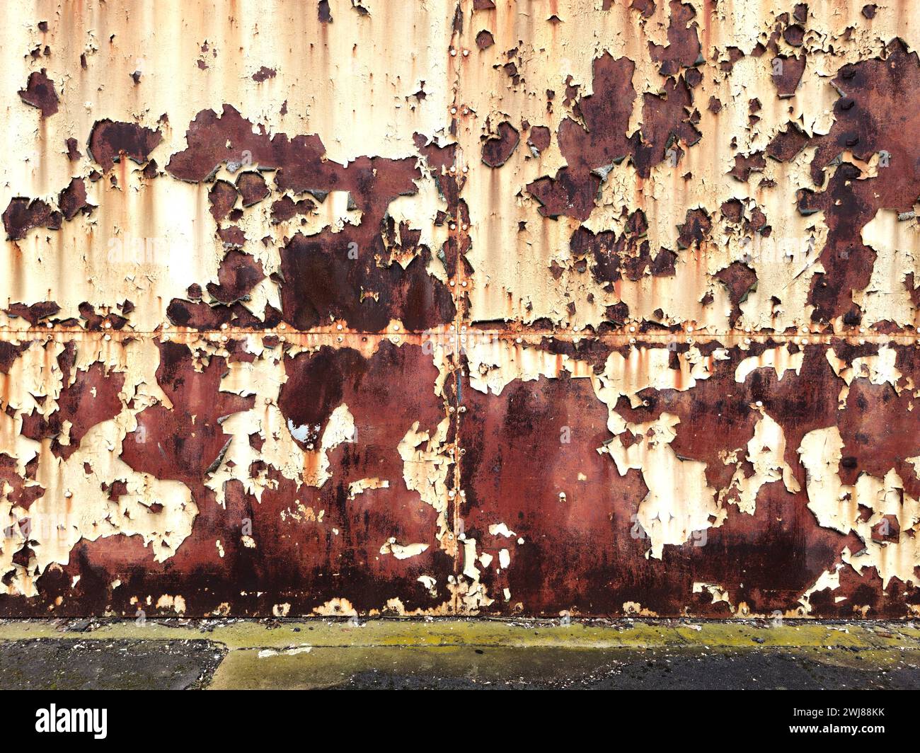 Peeling paint and rust on hangar doors Stock Photo - Alamy