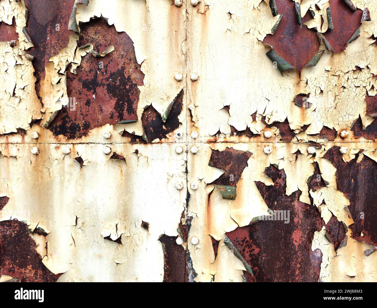 Peeling paint and rust on hangar doors Stock Photo - Alamy