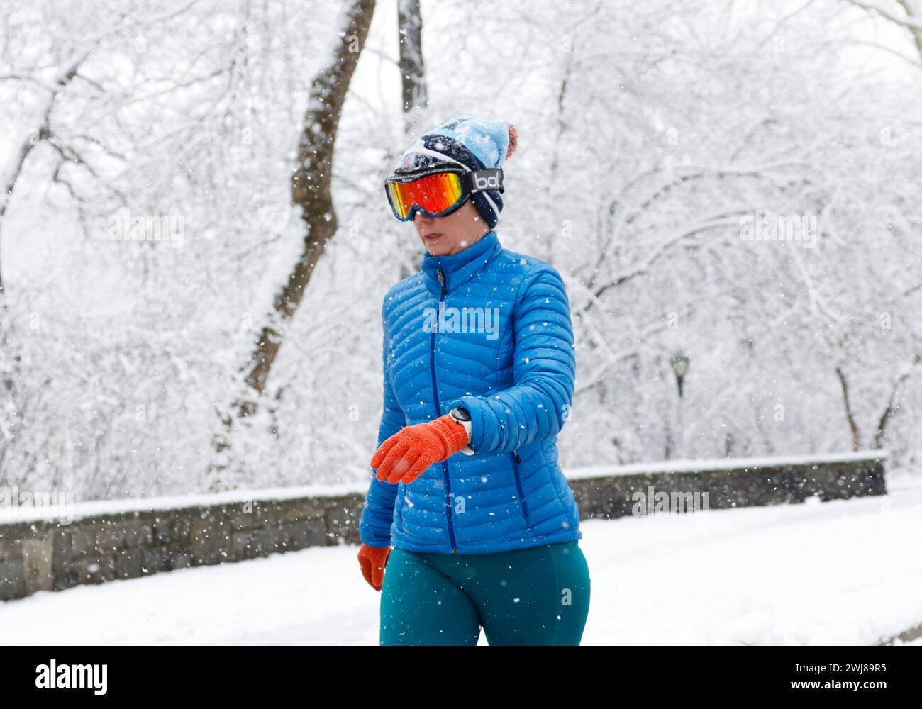 New York, United States. 13th Feb, 2024. A pedestrians bundled up for ...