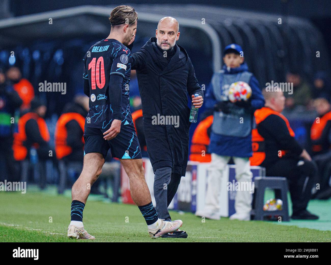Manchester City's Jack Grealish is substituted and given a pat by Head ...