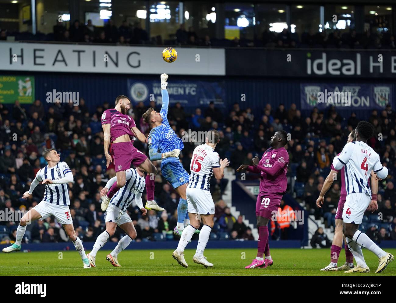 West Bromwich Albion goalkeeper Alex Palmer punches the ball clear ...