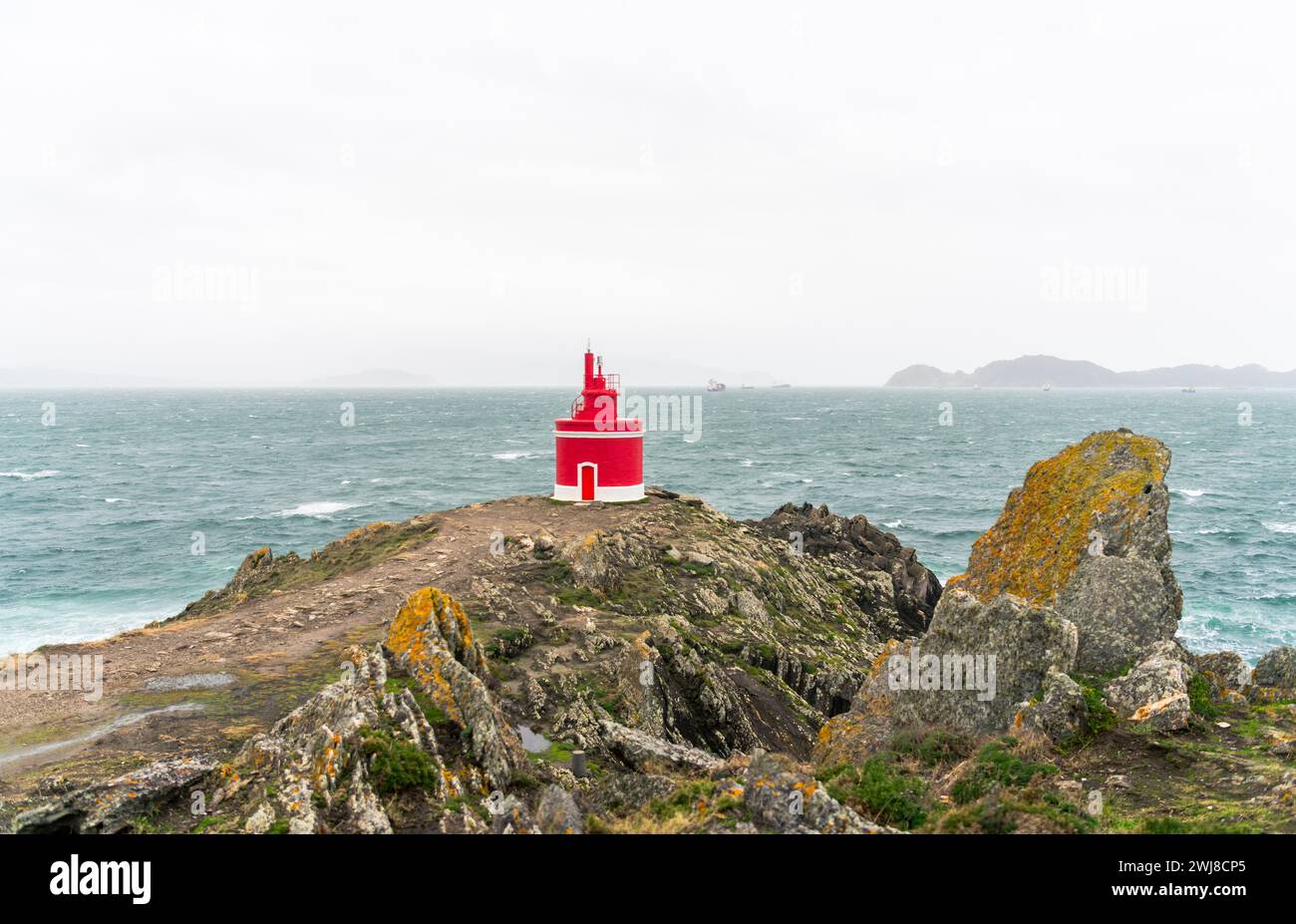 Red lighthouse in the north of Spain. Punta Robaleira lighthouse Stock ...